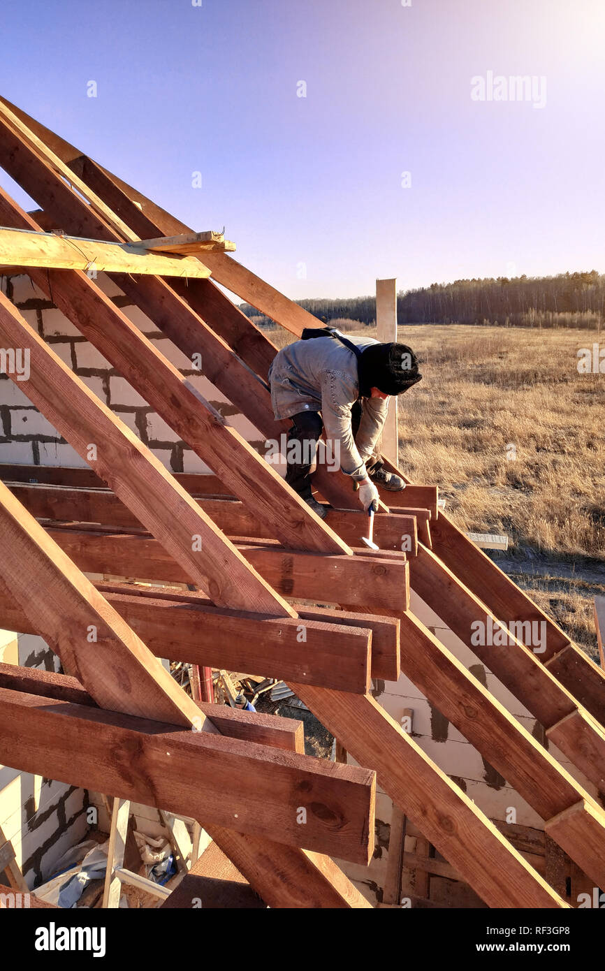 Layout and installation of roof rafters on a new commercial residential ...