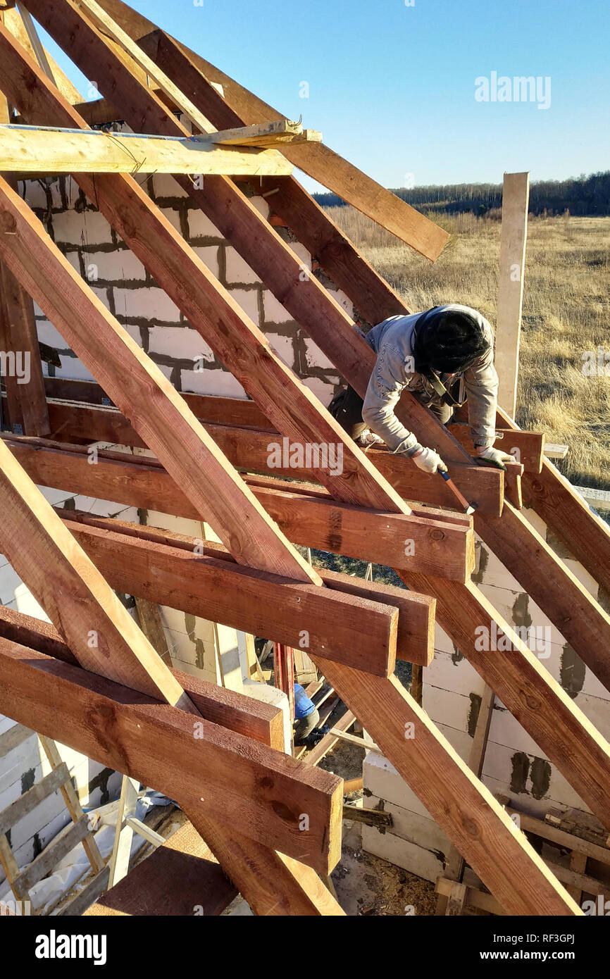 Layout and installation of roof rafters on a new commercial residential ...