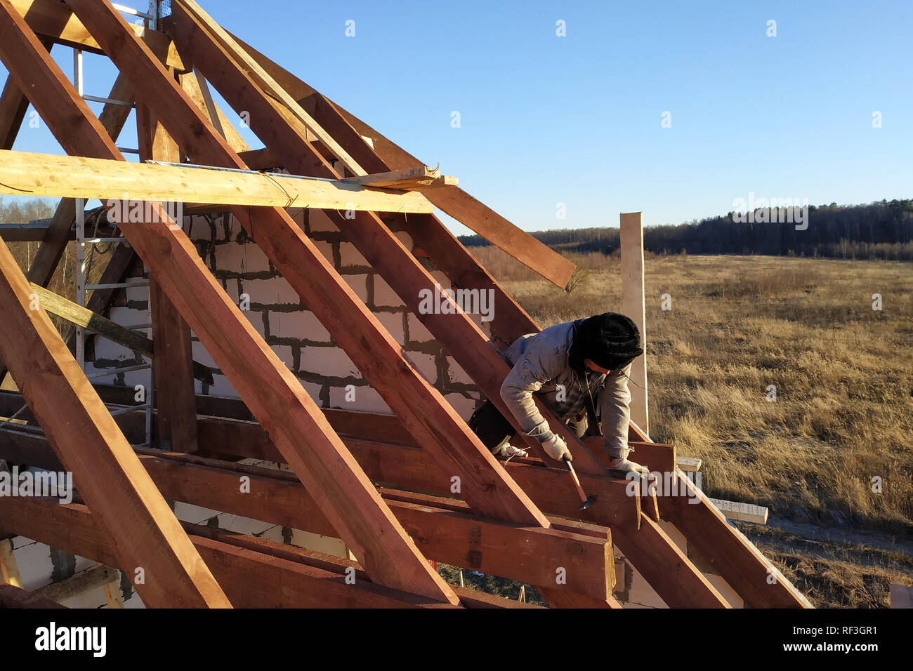 Layout and installation of roof rafters on a new commercial residential ...