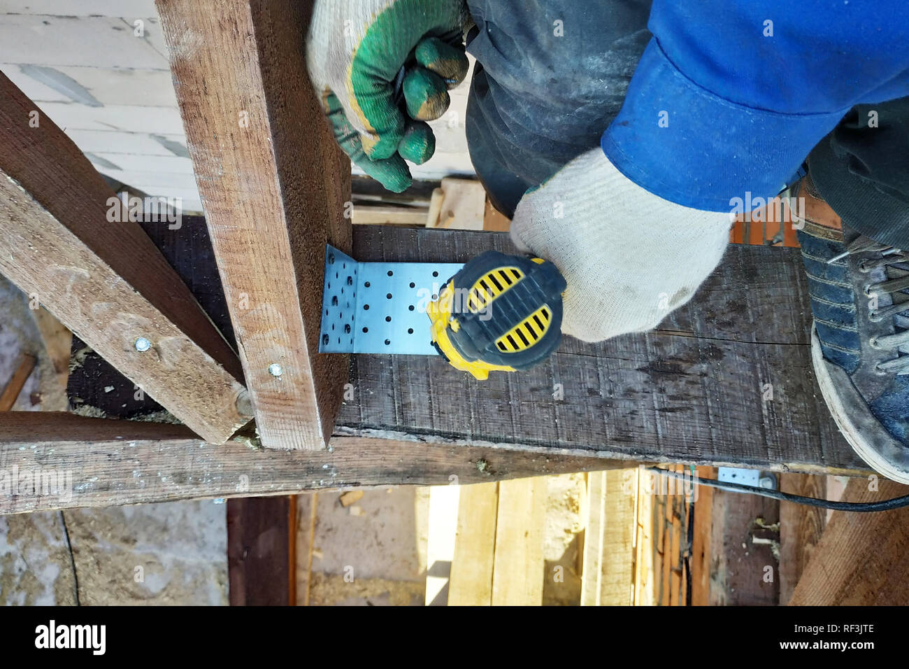 master screwdriver screwdriver screw into a wooden board 2019 Stock ...