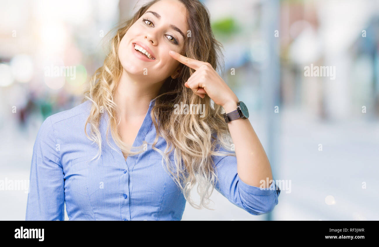 Beautiful young blonde business woman over isolated background Pointing ... Beautiful young blonde business woman over isolated background Pointing ...