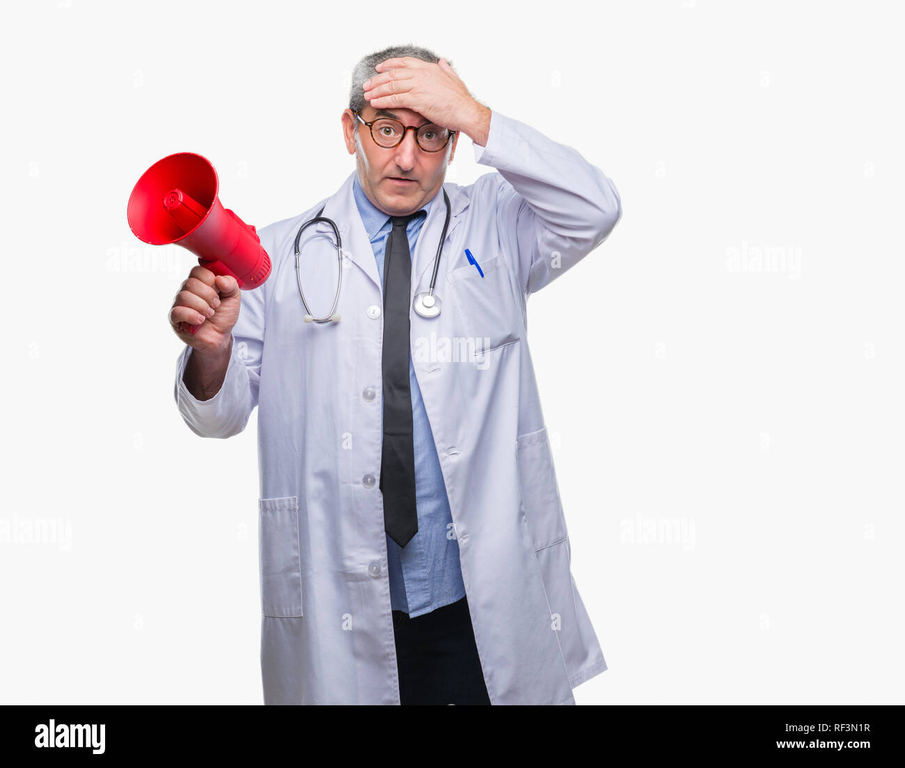 Handsome senior doctor man yelling through megaphone over isolated ...