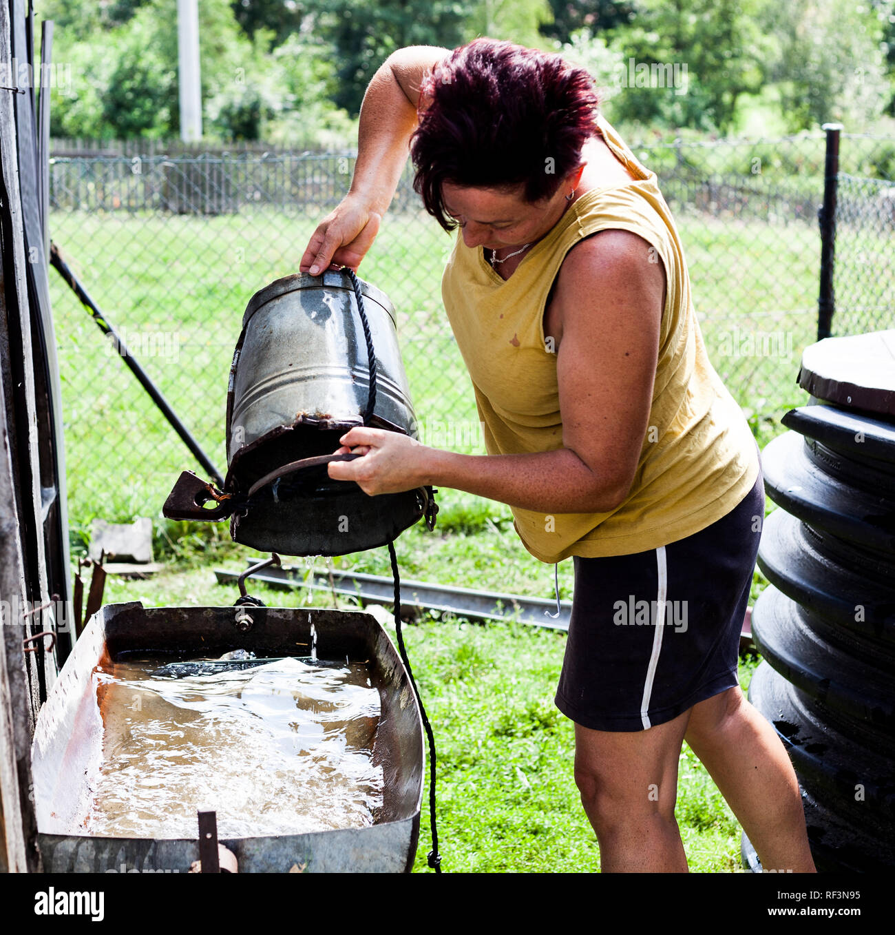Woman Fetching Water High Resolution Stock Photography and Images - Alamy