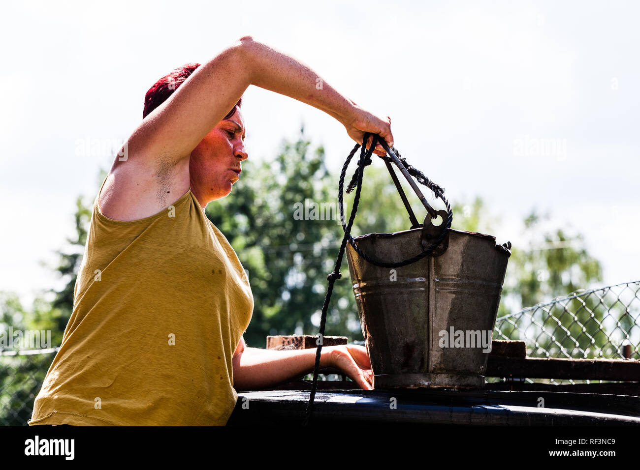 Woman fetching water and plant hi-res stock photography and images - Alamy