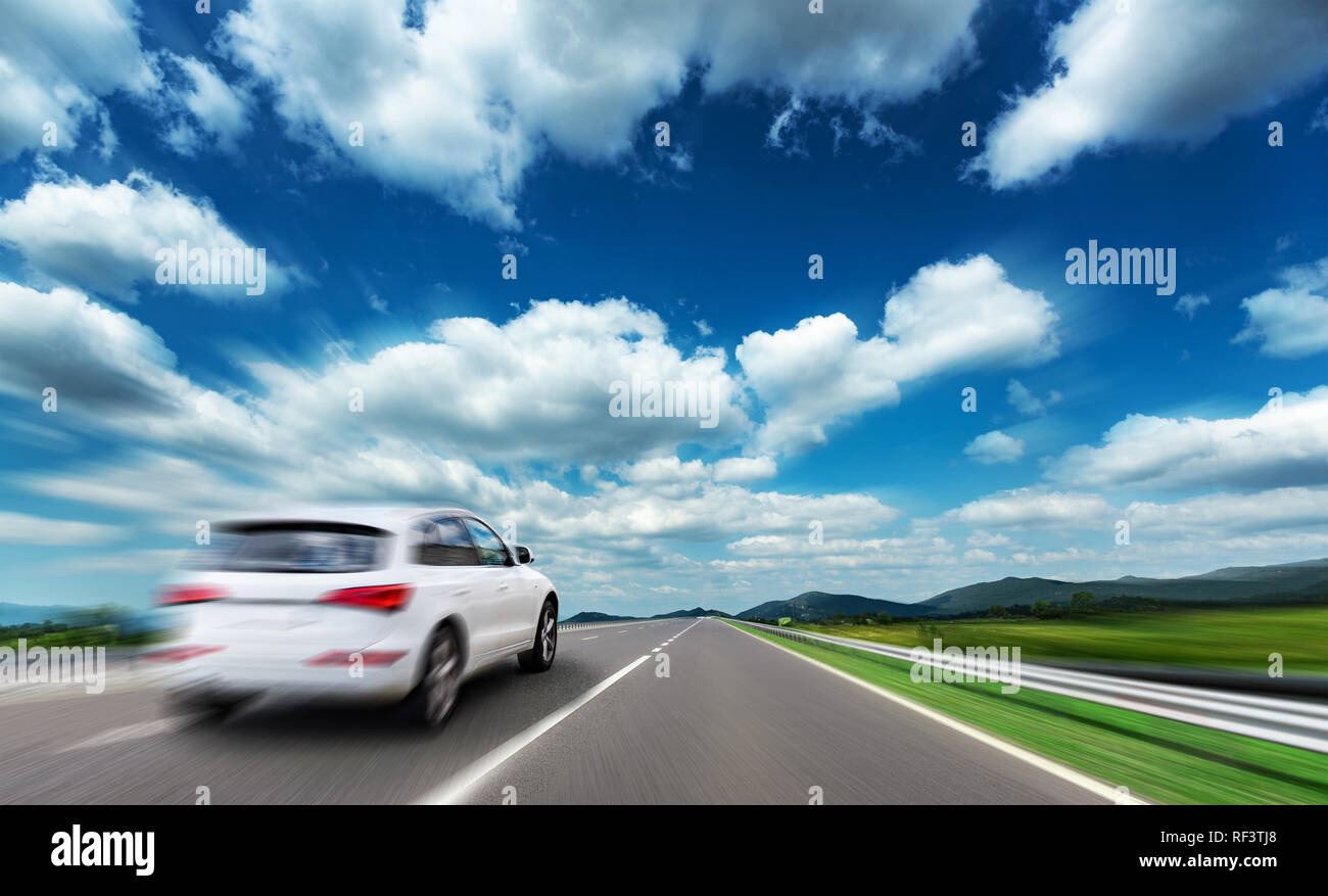 White car moving on highway Stock Photo - Alamy