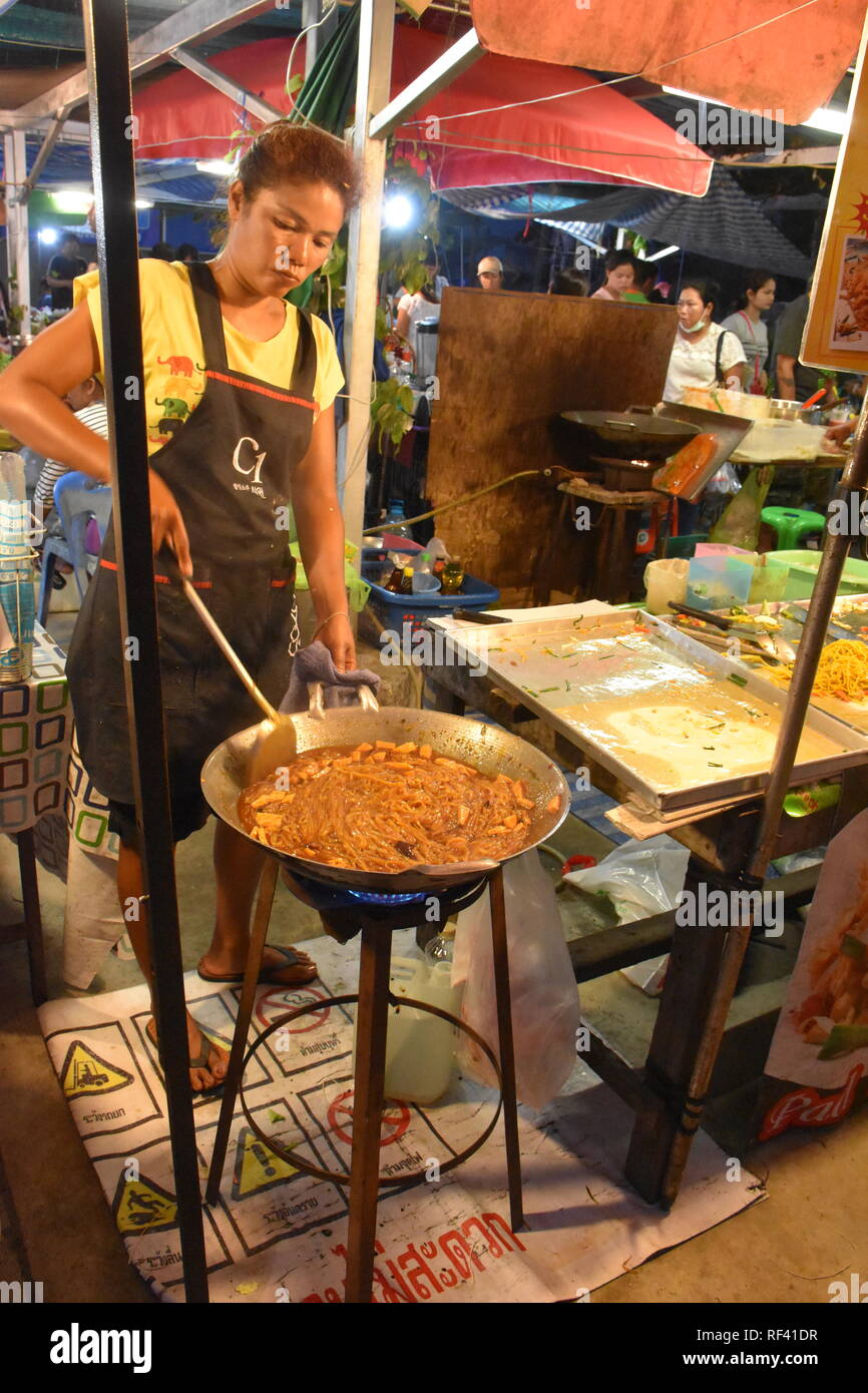 Woman is cooking on a street market Stock Photo - Alamy