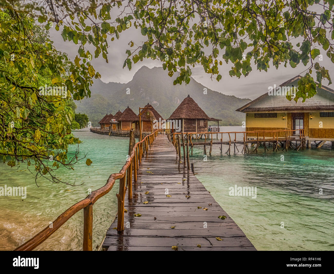 Ora Beach, Indonesia - February 14, 2018: Wooden pond on the water in ...