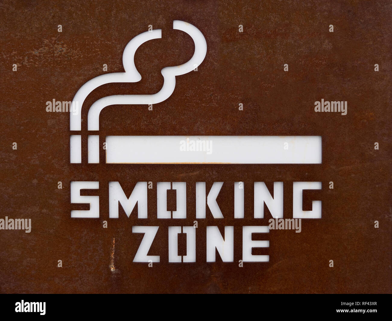 Close-up of designated smoking area sign. Sign of smoking zone. For ...
