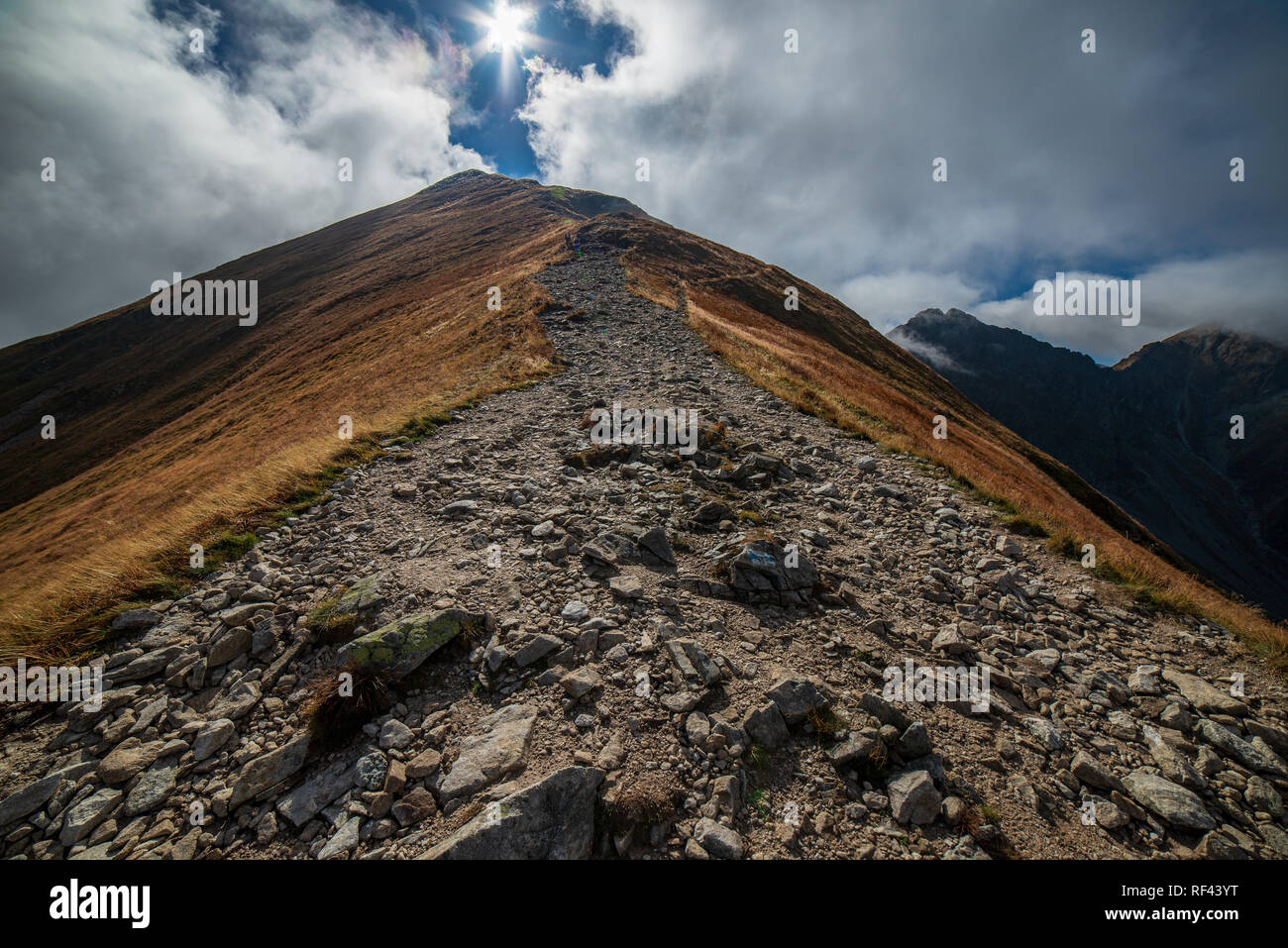 walking above clouds in slovakian Tatra mountains. marked tourist ...