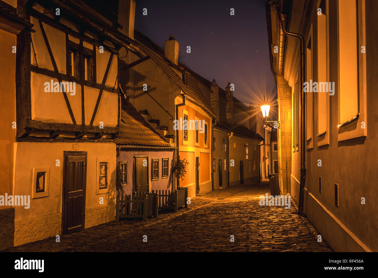 The Golden street at Prague at night Stock Photo - Alamy