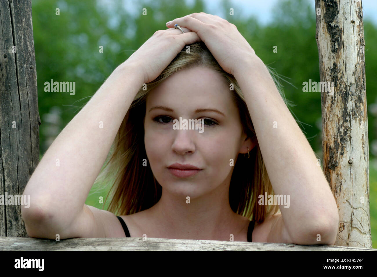 Pretty Caucasian blonde woman in a rural setting Stock Photo - Alamy