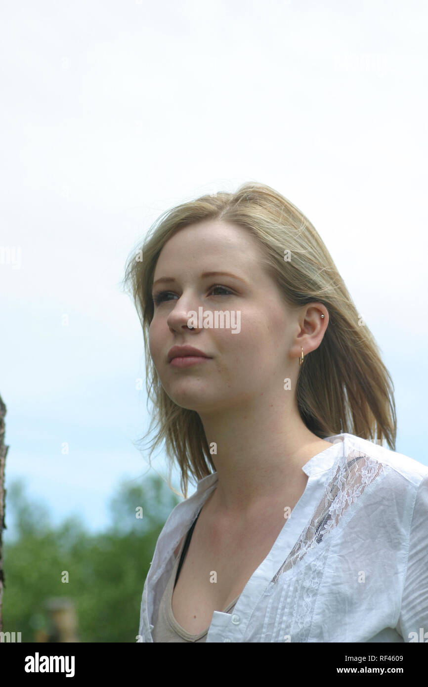 Pretty Caucasian blonde woman in a rural setting Stock Photo - Alamy