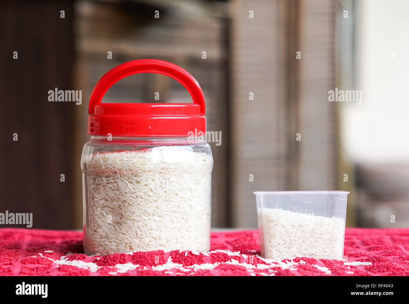 Rice in big and small containers Stock Photo - Alamy