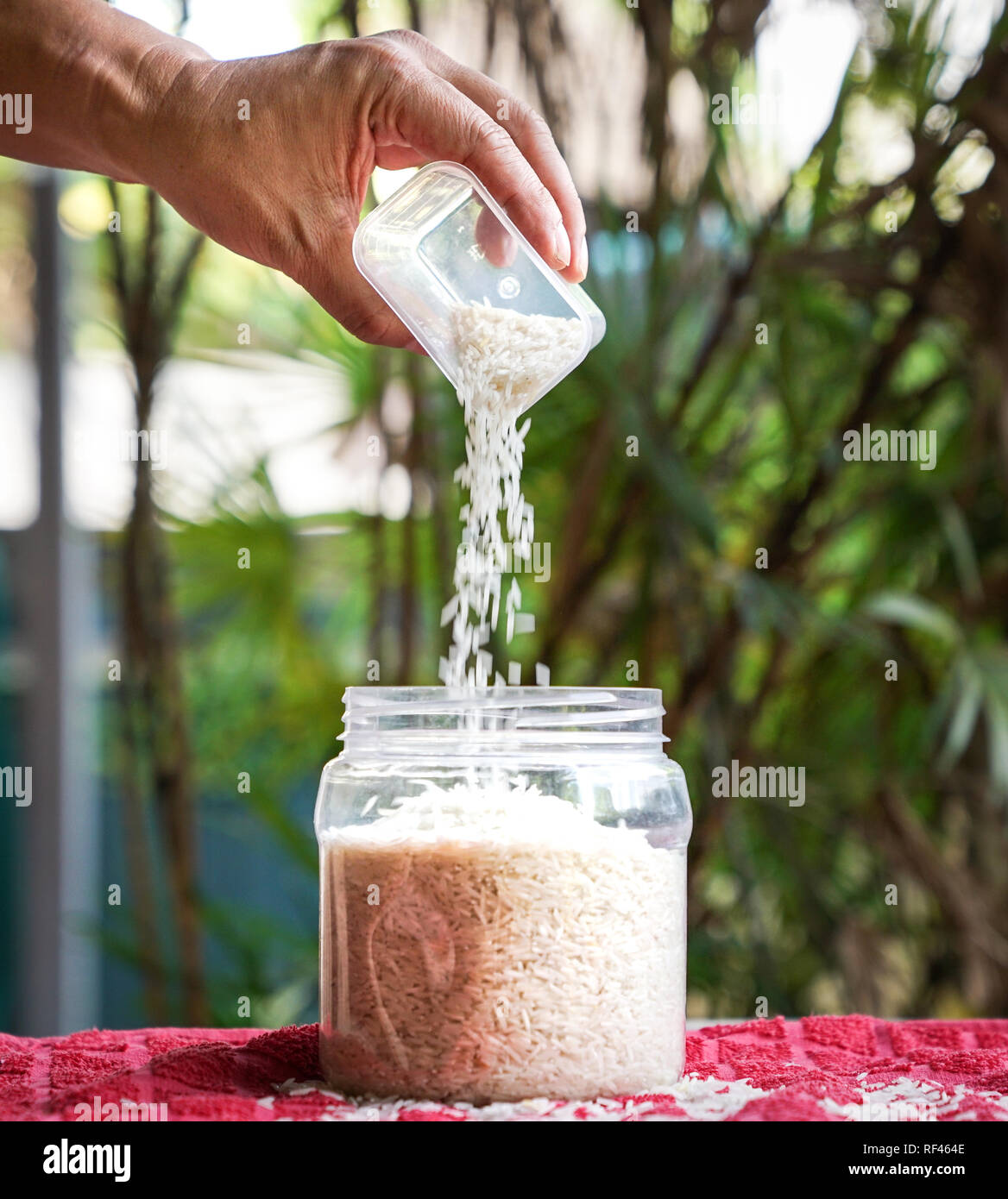 Rice in big and small containers Stock Photo - Alamy