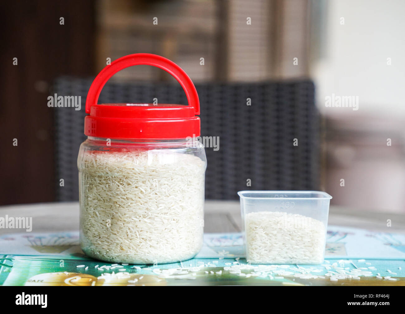 Rice in big and small containers Stock Photo - Alamy