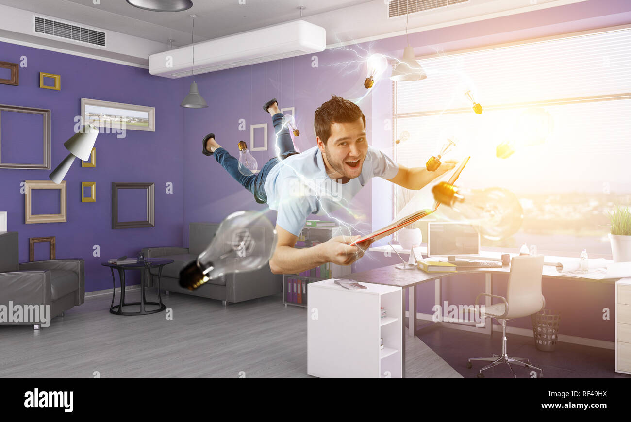 Funny guy with book in hands levitating in air. Mixed media Stock Photo ...