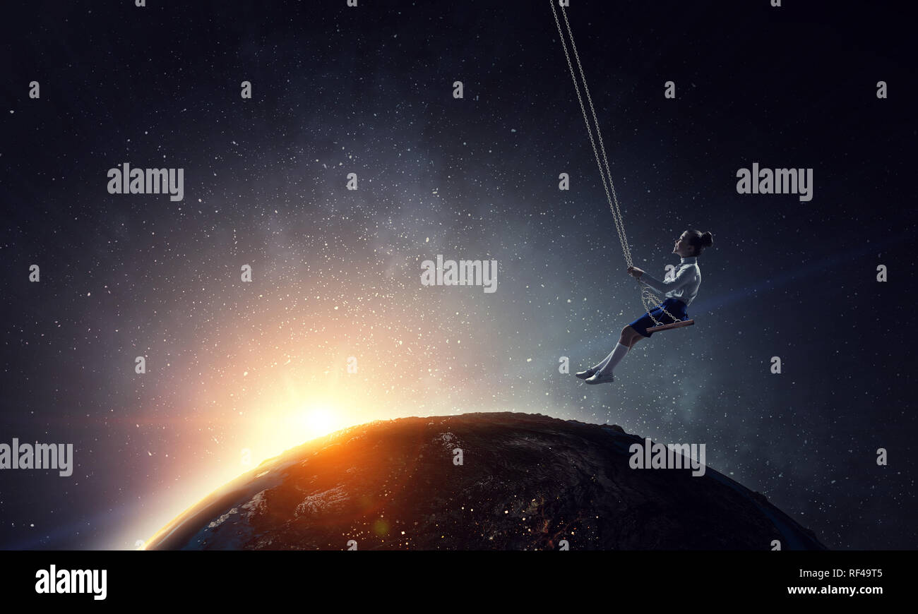 Cute little girl riding on swing. Elements of this image are furnished ...