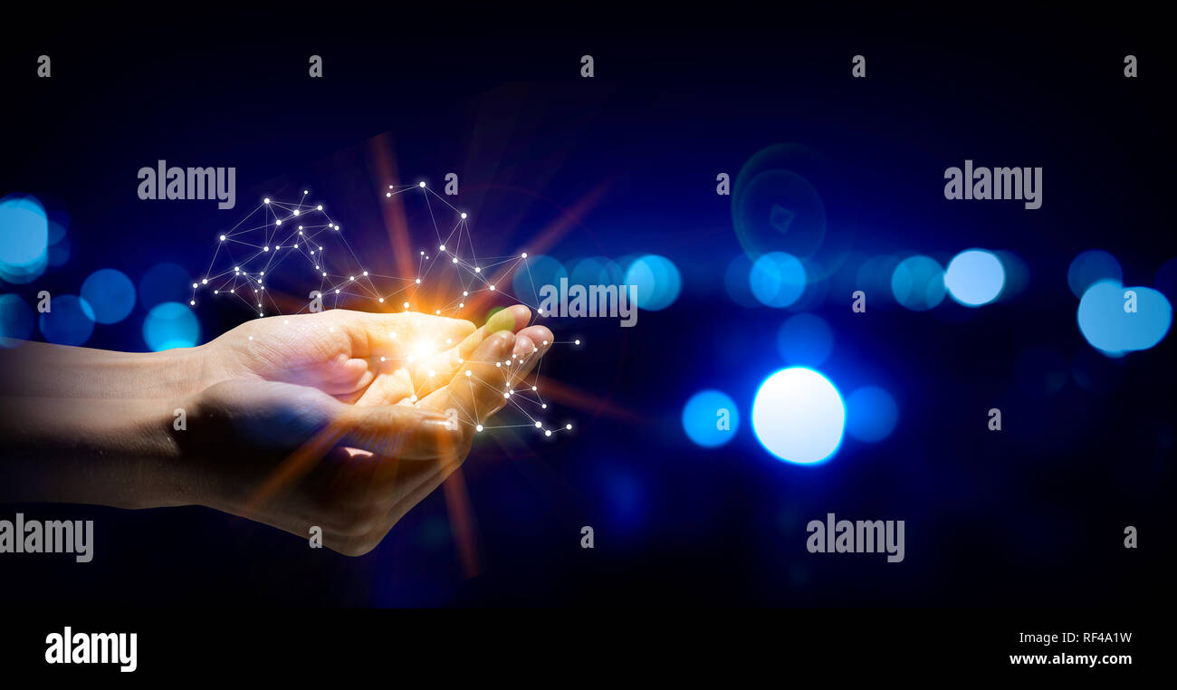 Male hand with light glowing in palm against dark background Stock ...