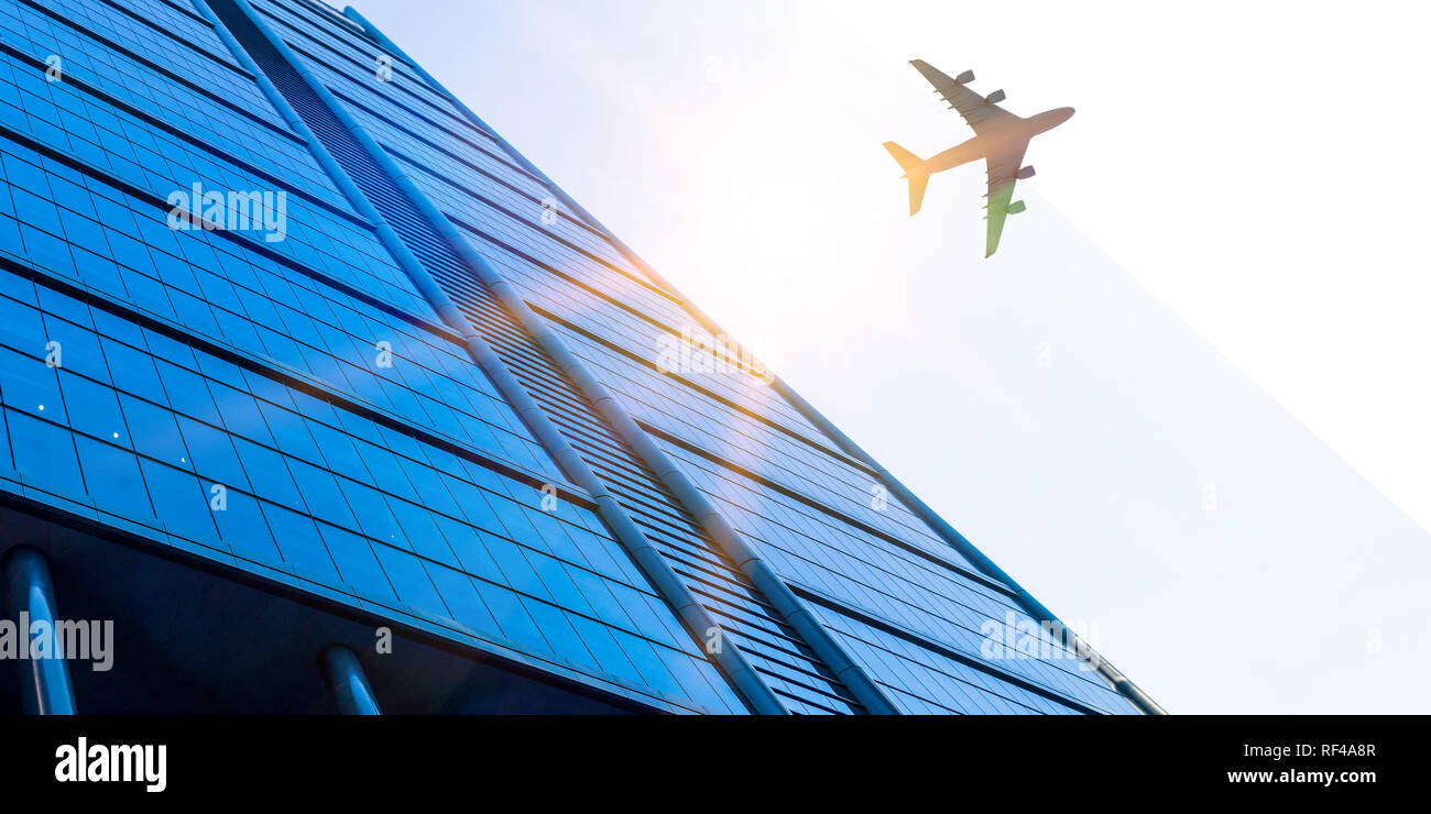 Airplane in sky over city hi-res stock photography and images - Alamy