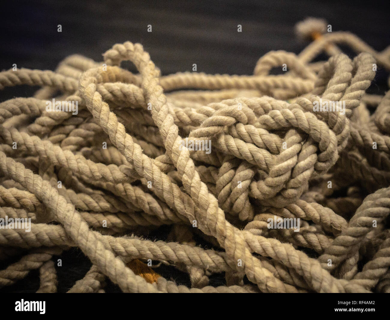 Pile of worn cotton rope with whipped ends Stock Photo - Alamy