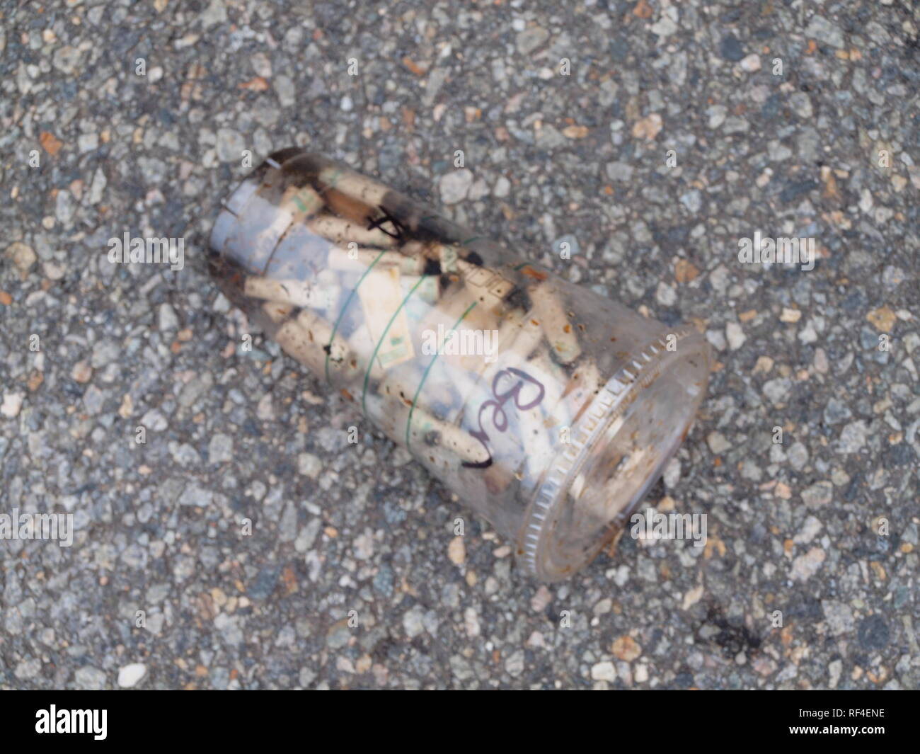 Disgusting litter seen on a local NJ parking lot Stock Photo - Alamy