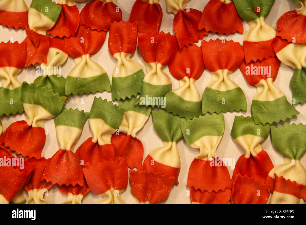 Traditional small farfalle pasta with Italian flag Stock Photo - Alamy