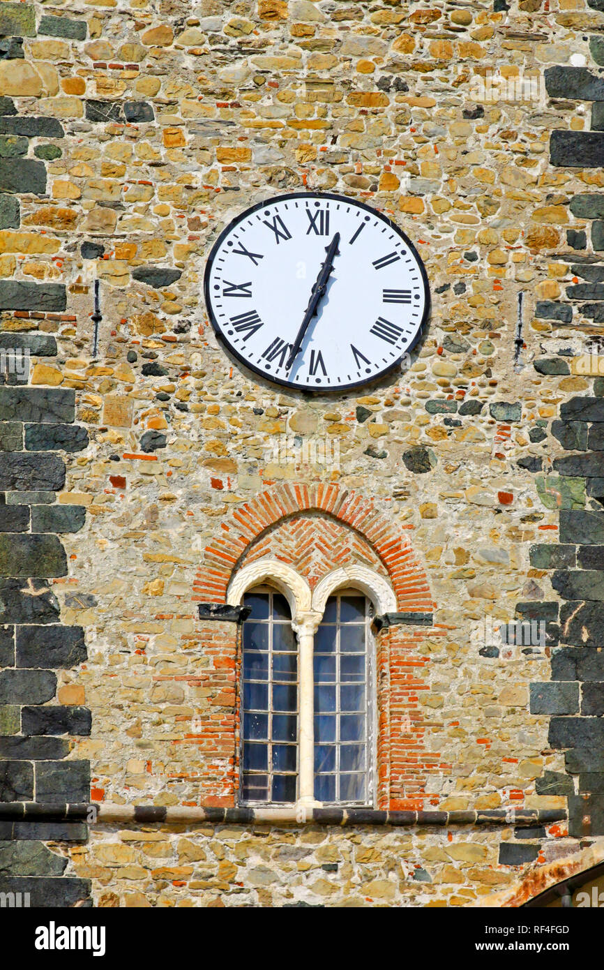 Medieval castle tower with clock in Italy Stock Photo - Alamy