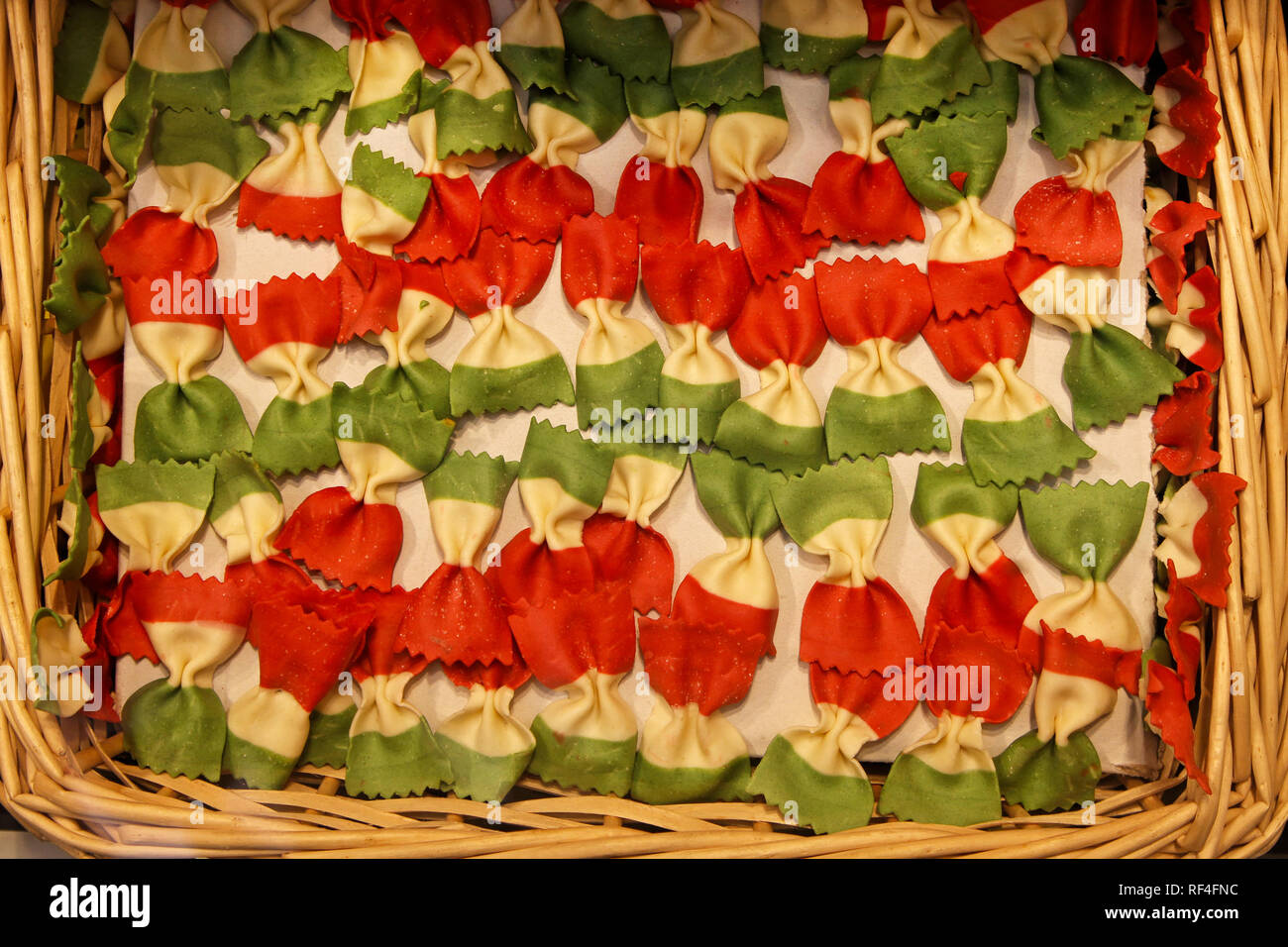 Traditional pasta with Italian flag in basket Stock Photo - Alamy