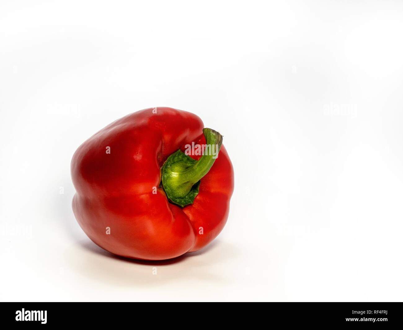Red pepper pod, on a white background Stock Photo - Alamy