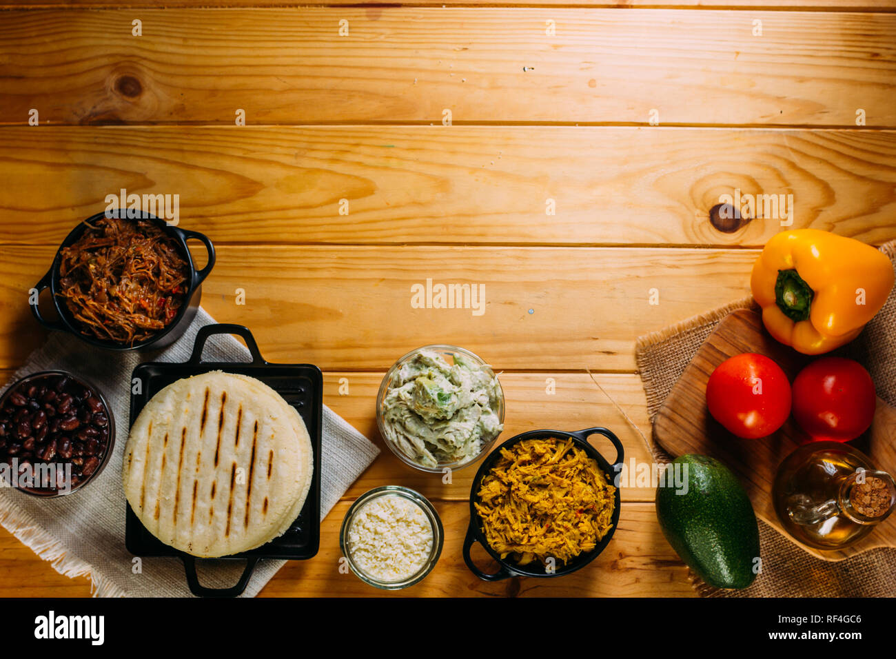 Top view of South American food called arepa and different ingredients ...