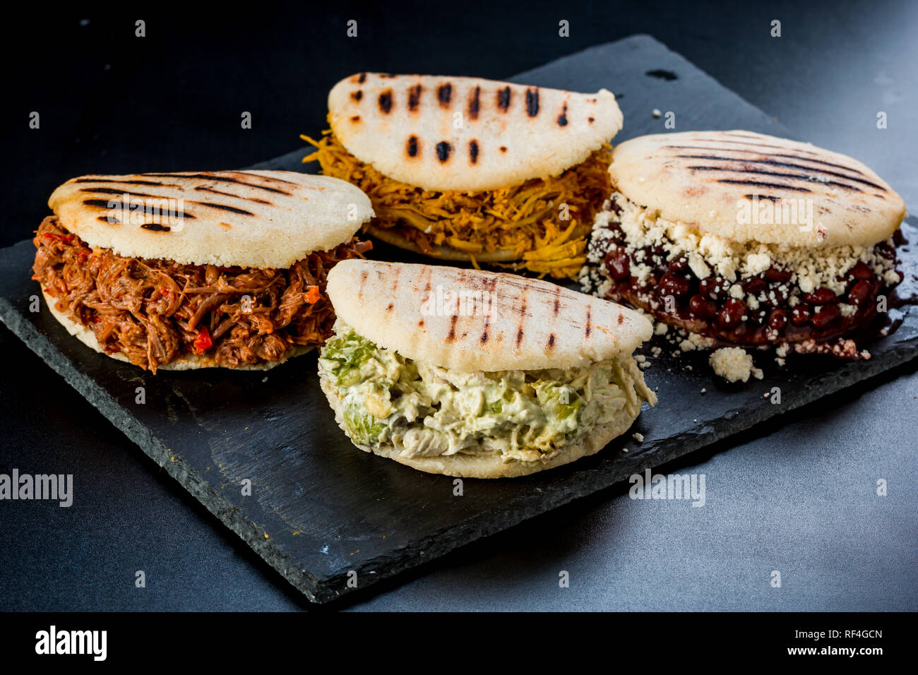 Venezuelan Latin American food, 4 arepas of different stuffing on a ...
