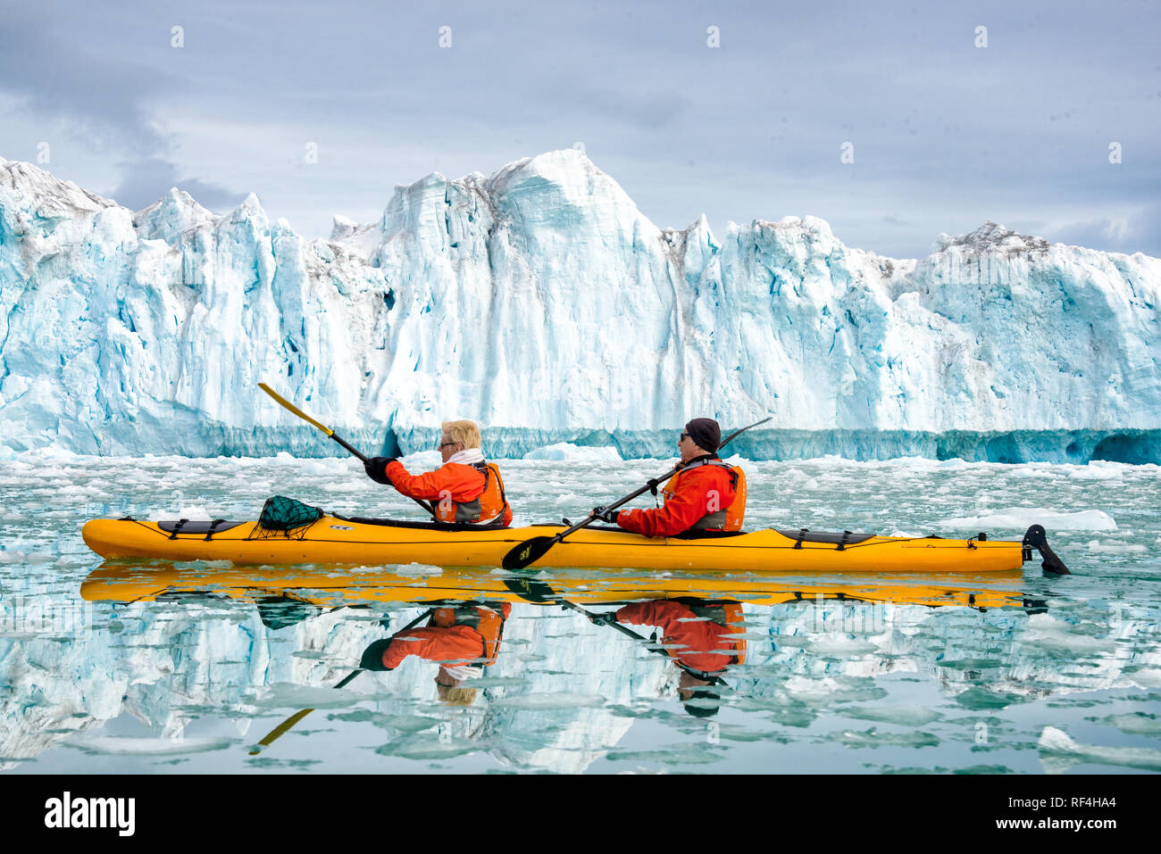 SVALBARD, Norway — Kayaking tourists explore the icy waters and ...