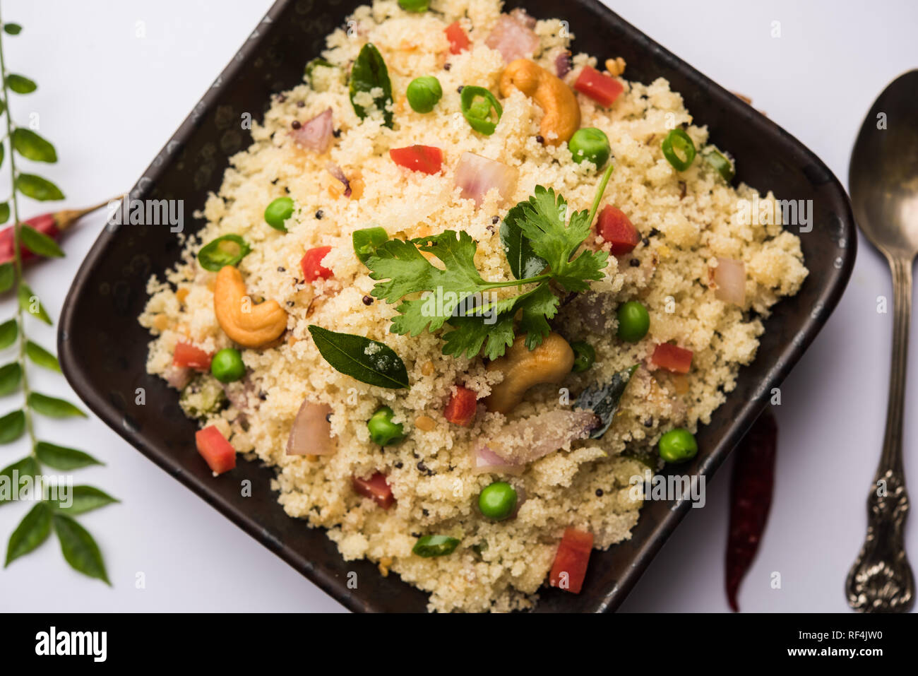 Rava Upma / Uppuma - south indian breakfast served in a bowl. selective ...