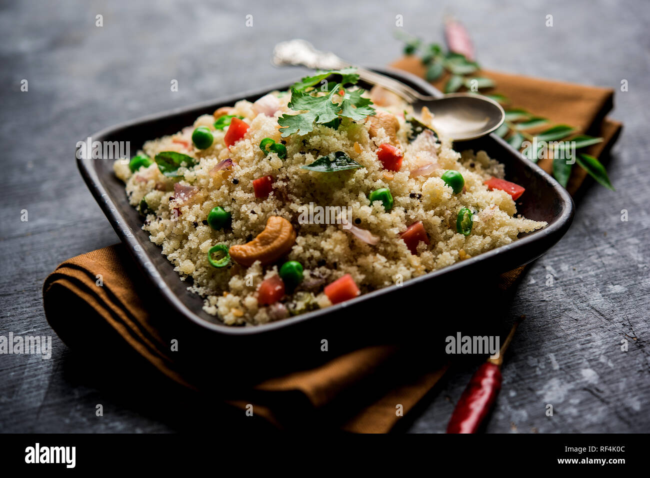 Rava Upma / Uppuma - south indian breakfast served in a bowl. selective ...