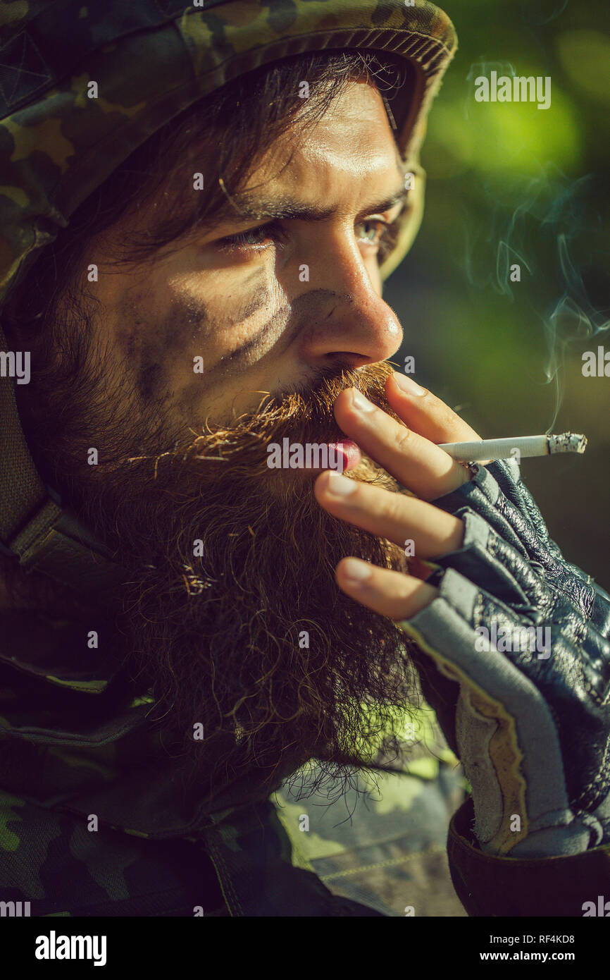 Soldier smoking cigarette Stock Photo - Alamy
