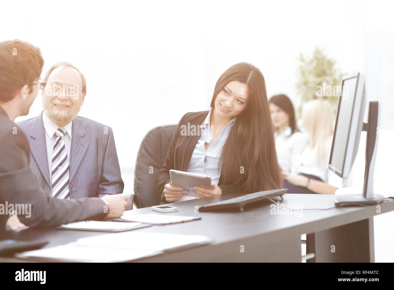 Professional colleagues organizing office hi-res stock photography and ...