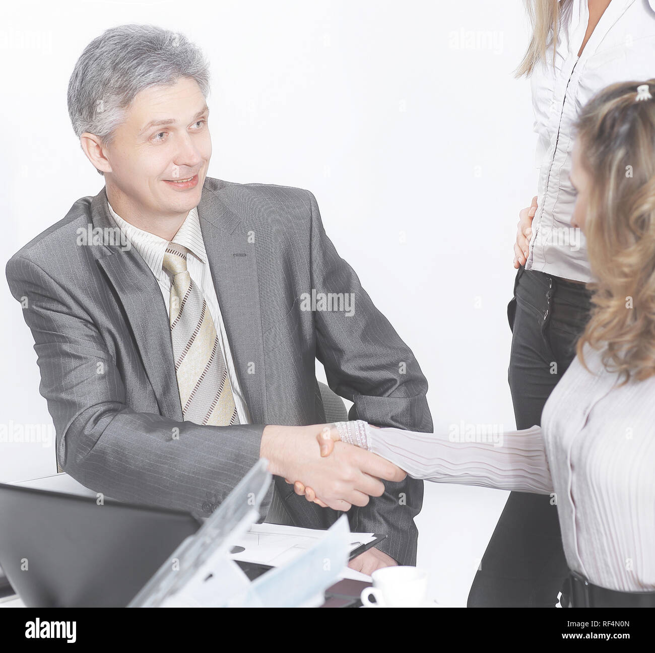 handshake Manager and the client in the office Stock Photo - Alamy