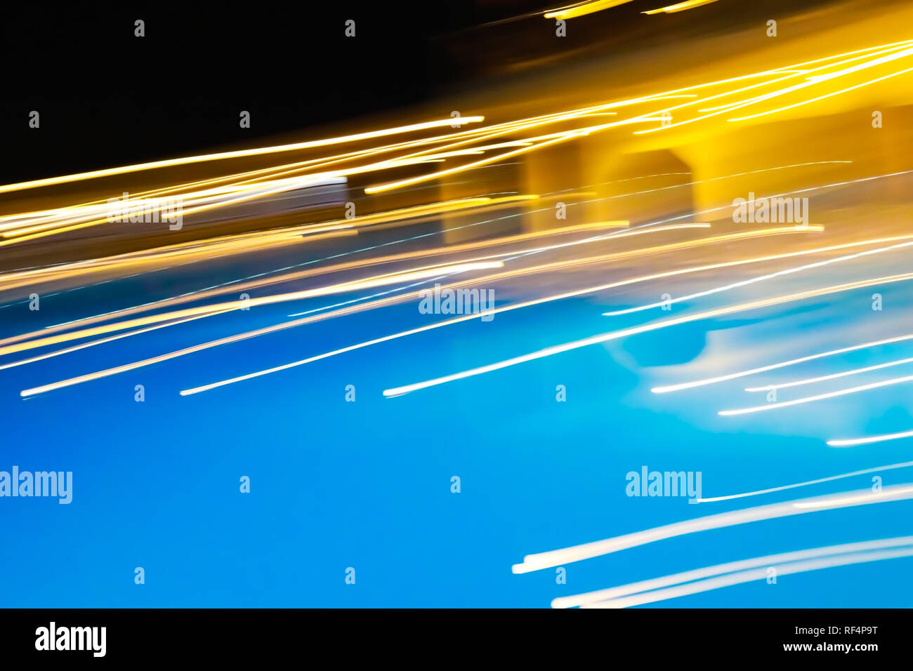 Bright direct white and yellow light strips on black-yellow-blue ...