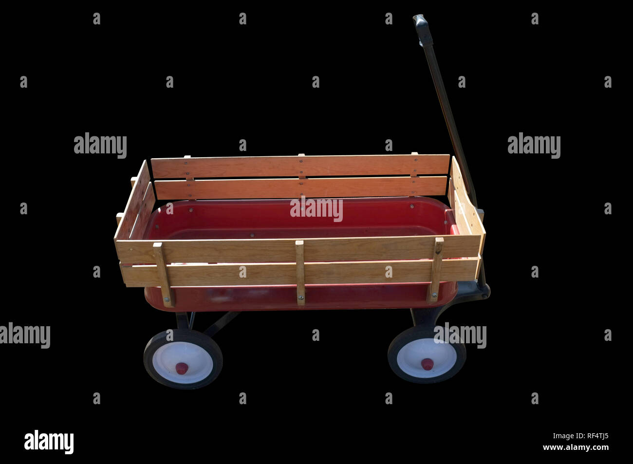 Little red wood wagon on black background Stock Photo - Alamy