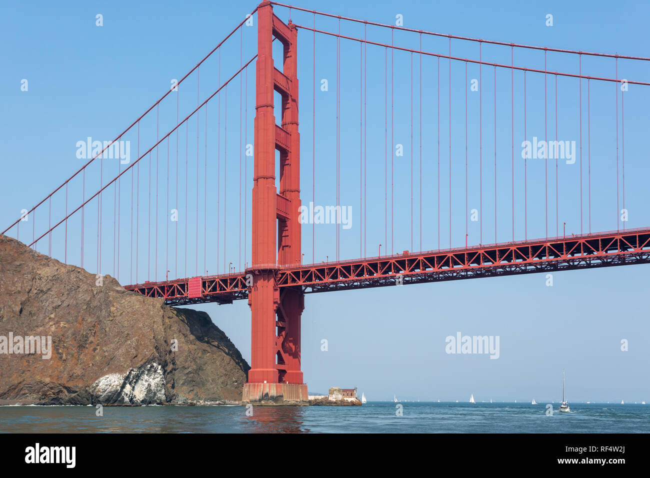 bright red Golden Gate Bridge tower in San Francisco Bay Stock Photo ...
