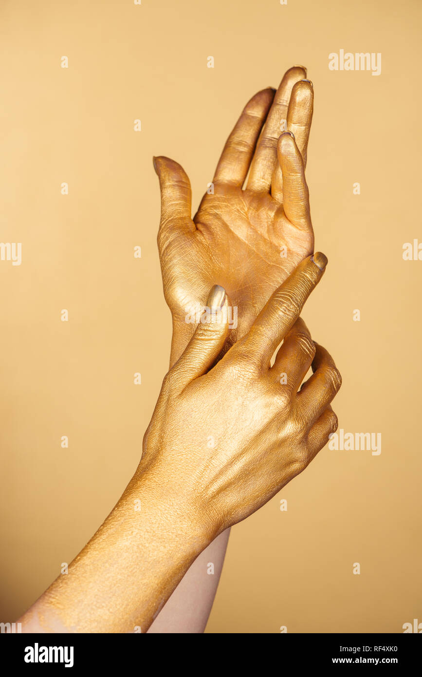 Gold painted hands hi-res stock photography and images - Alamy