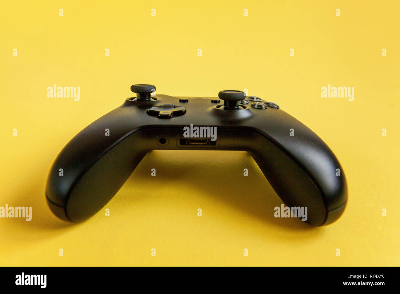 Black joystick gamepad, game console on yellow colourful trendy modern ...
