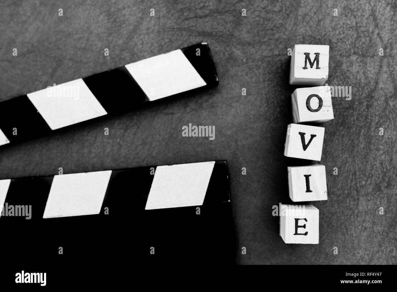 High angle view of film slate and movie text letters message black and ...