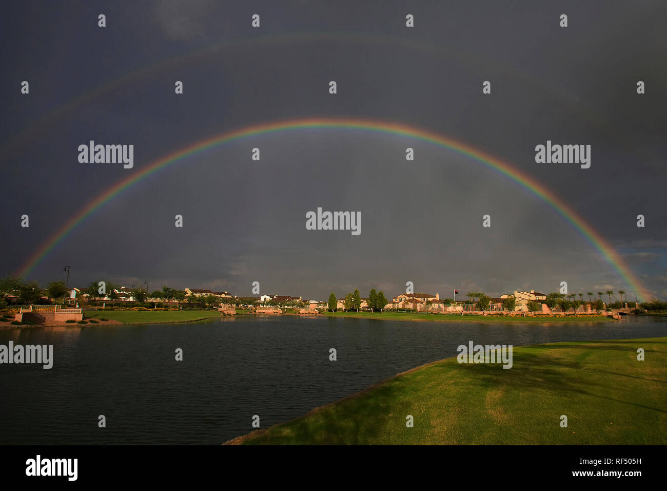 A rainbow appears in Phoenix, Arizona after a rain storm Stock Photo ...
