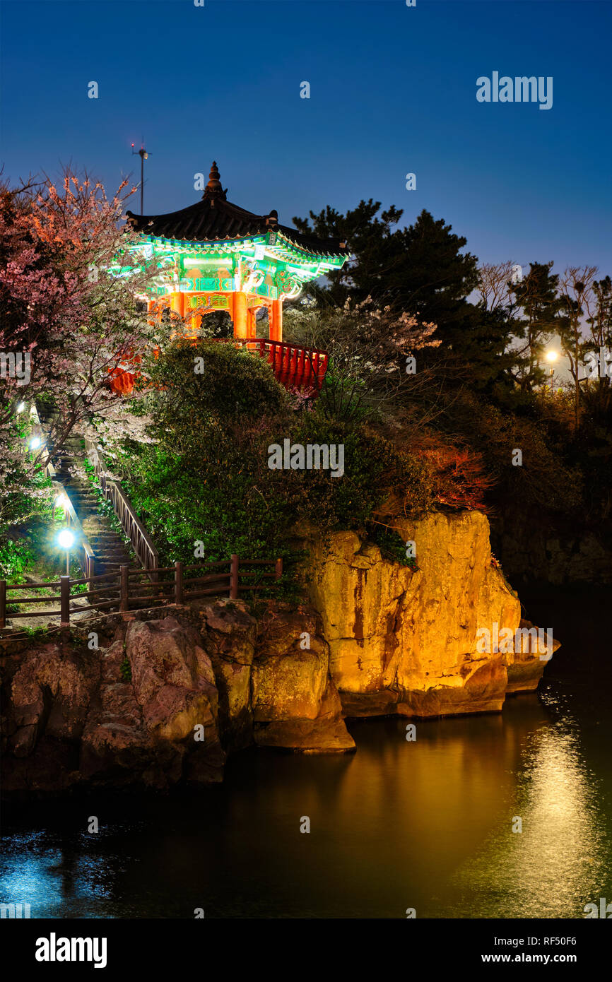 Scenic Yongyeon Pond with Yongyeon Pavilion illuminated at night, Jeju islands, South Korea ...