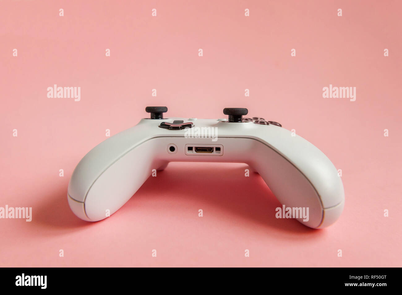 White joystick gamepad, game console on pink colourful trendy modern ...