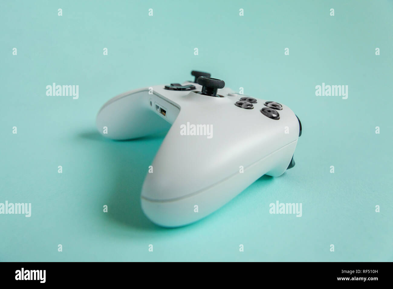 White Joystick Gamepad Game Console On Blue Colourful Trendy Modern