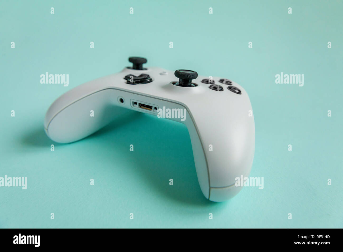 White joystick gamepad, game console on blue colourful trendy modern ...