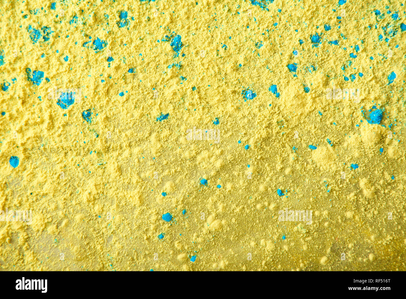 close up of yellow and blue holi powder Stock Photo - Alamy