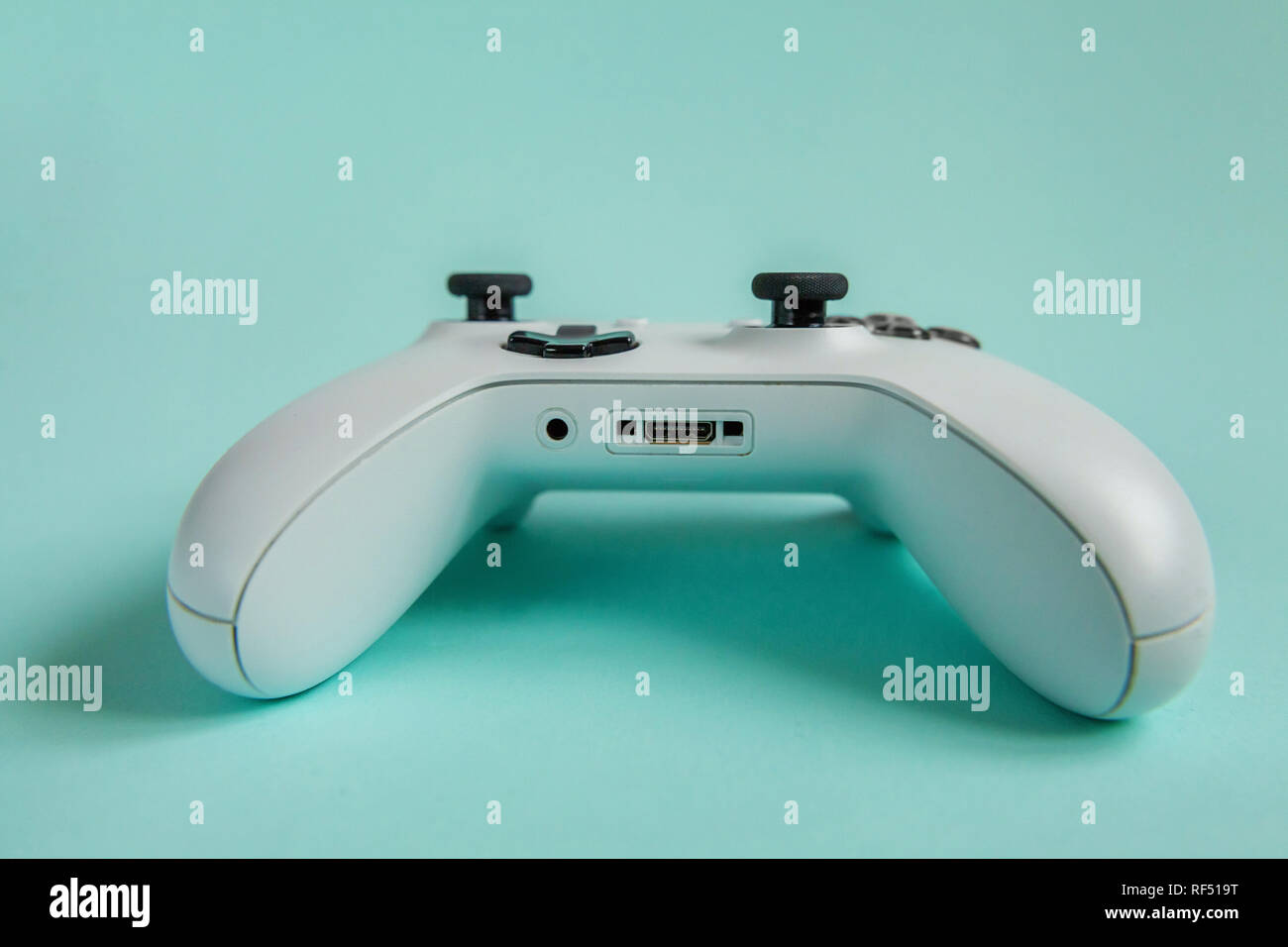 White joystick gamepad, game console on blue colourful trendy modern ...